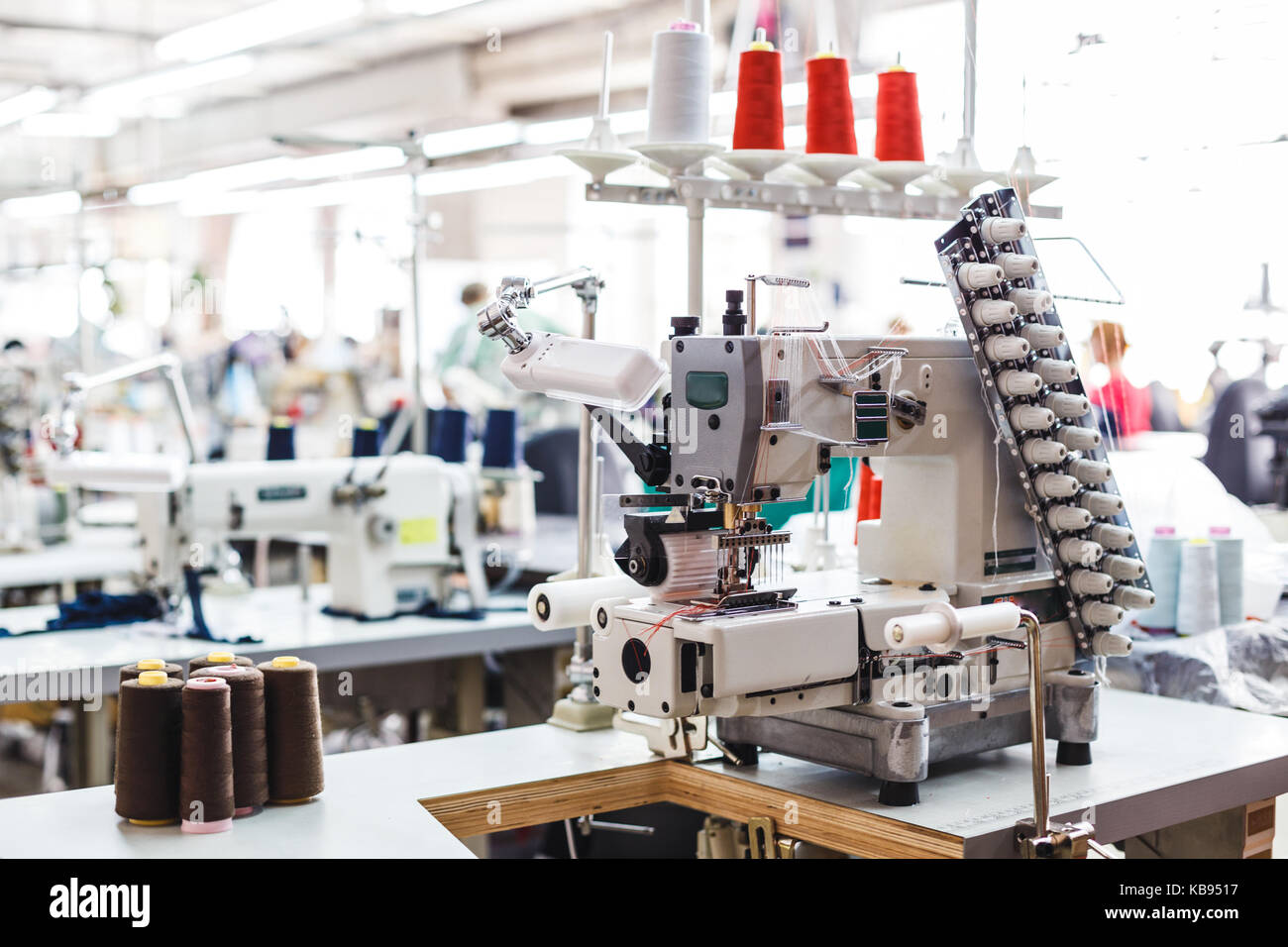 Professional sewing machine with different colors of threads in the ...