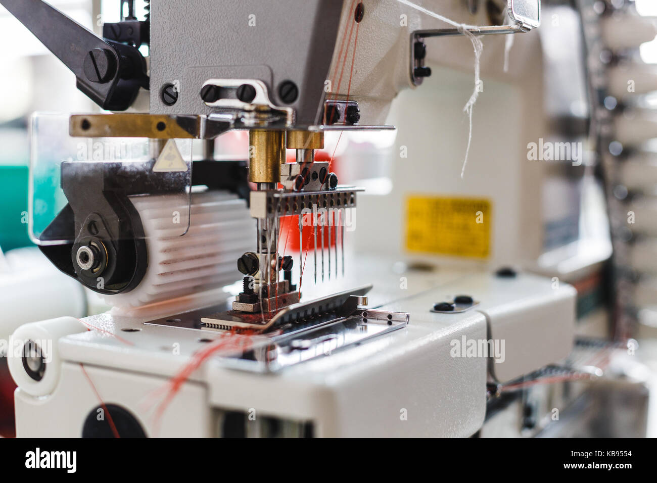 Closeup detail of the sewing machine. Sewing process in the phase of ...
