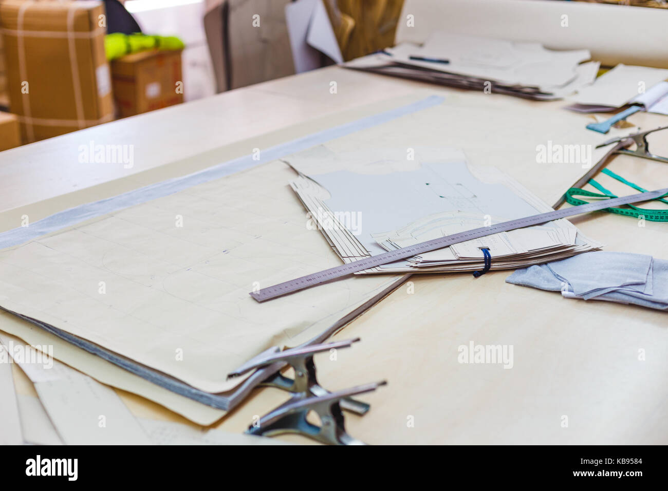 Still life photo of a clothes pattern template with ruler, tape measure ...