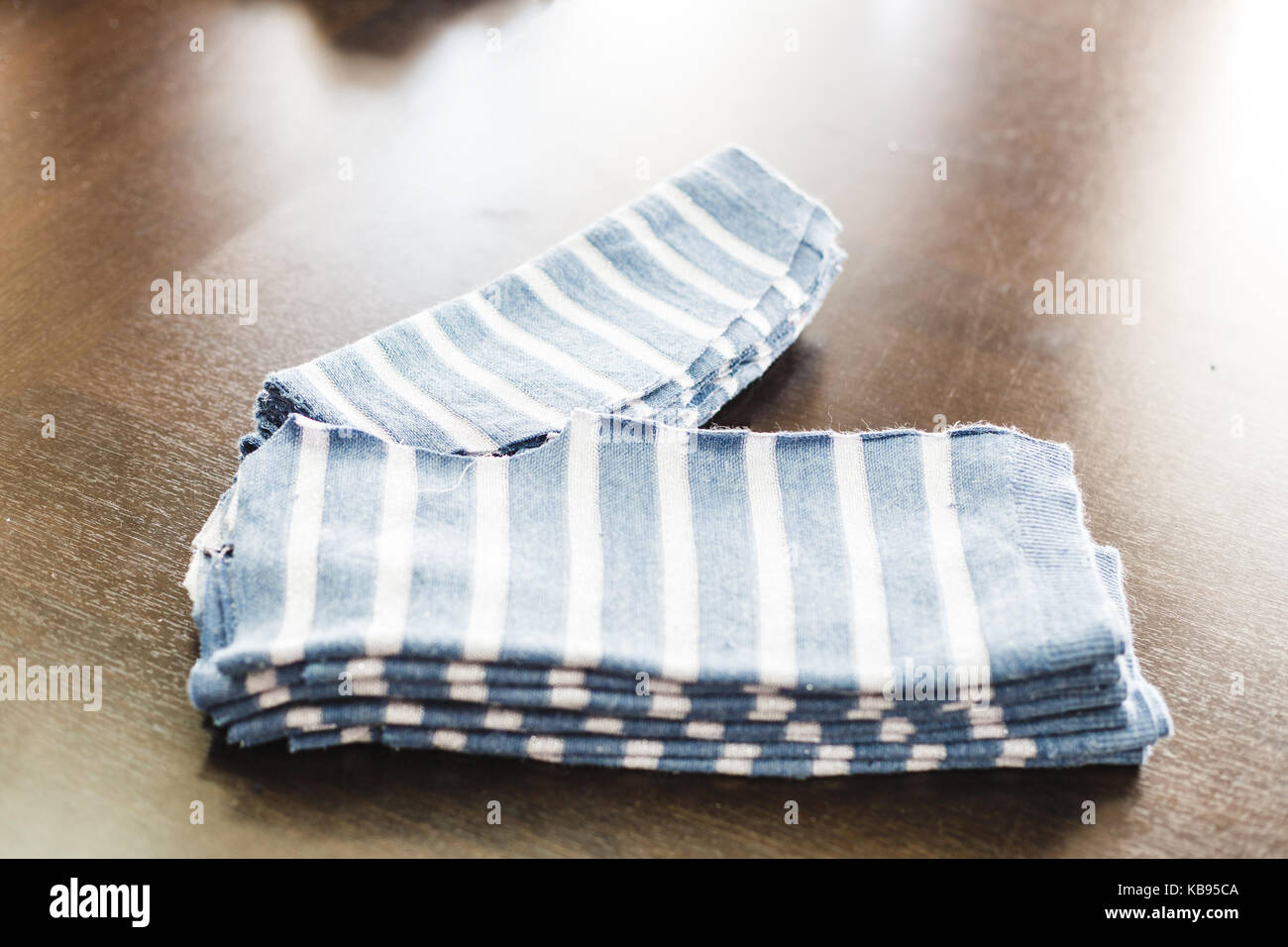 Tailoring clothes at the garment factory. Finished pieces of clothing ...