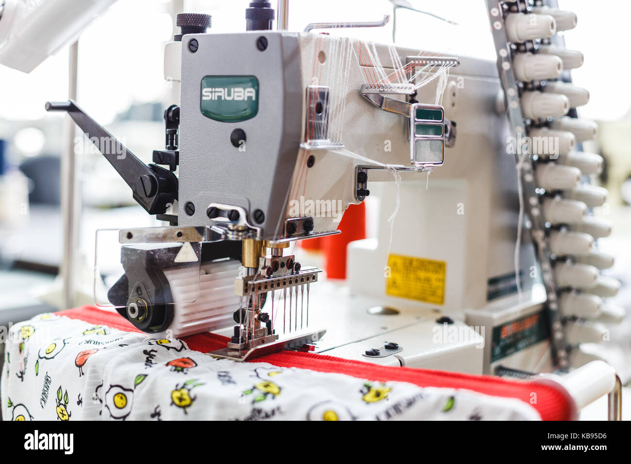 Fabric industry machinery production line. Industrial sewing machine ...