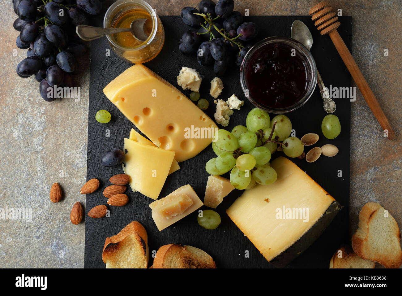 Cheeses mix on slate, food above Stock Photo - Alamy