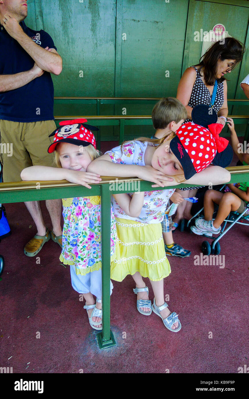 Children in a line / queue in disney world florida USA wearing mickey ...