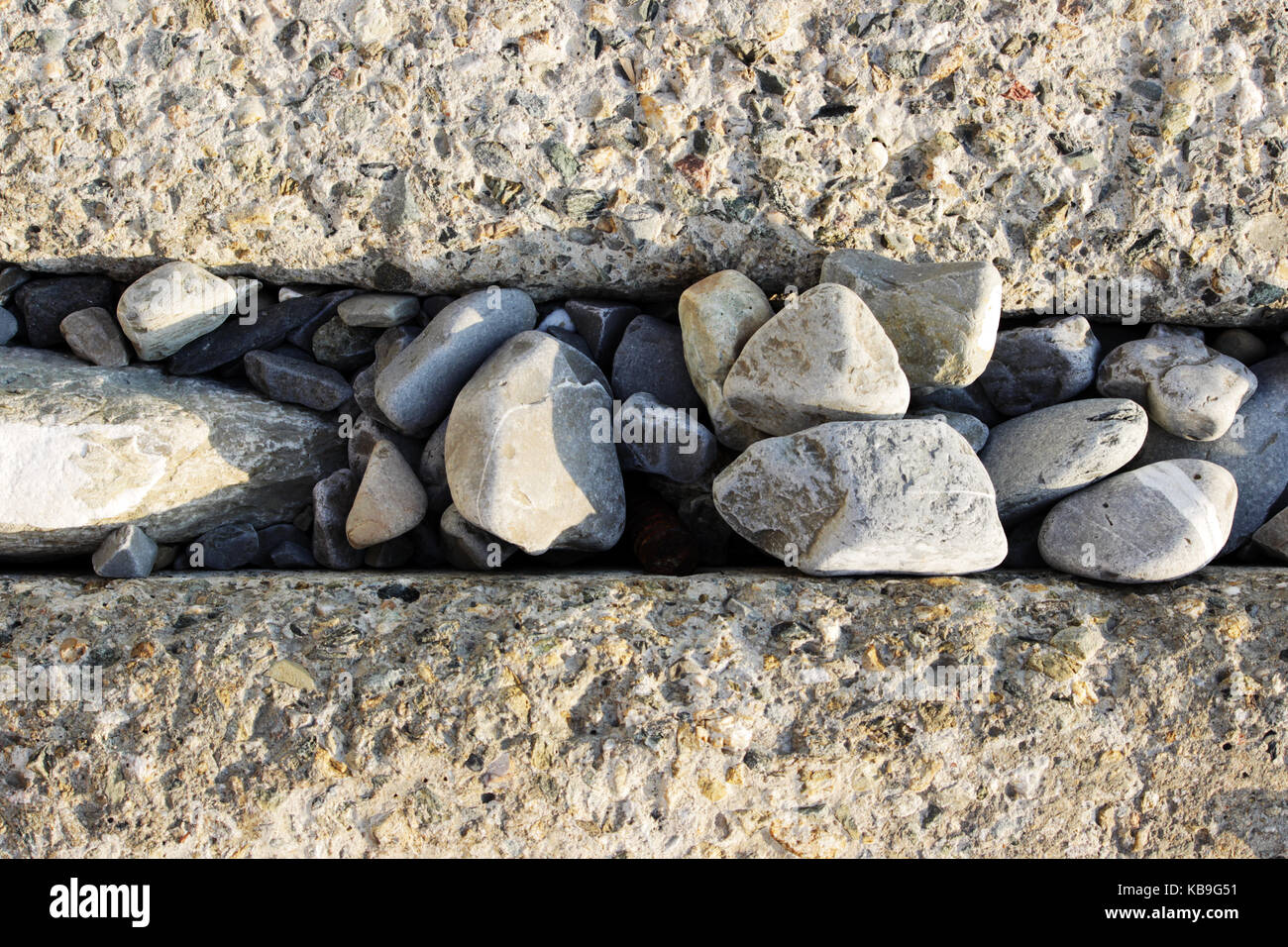 Large concrete rectangular blocks to protect the shore from erosion ...