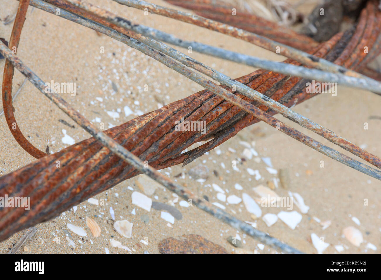 Steel rusty wire and wire on a concrete background Stock Photo - Alamy