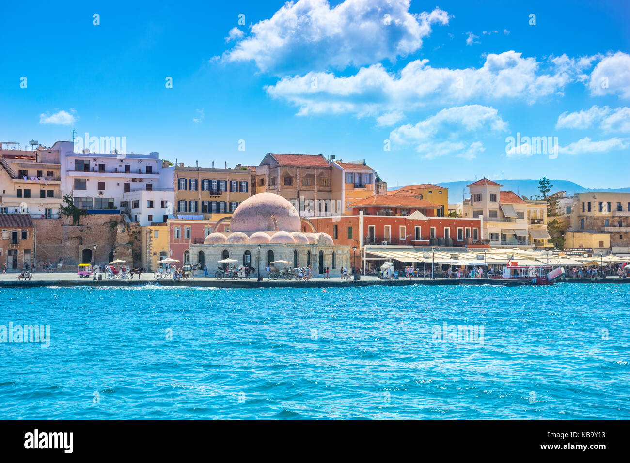 View of the old harbor of Chania with lighthouse and mosque, Crete ...