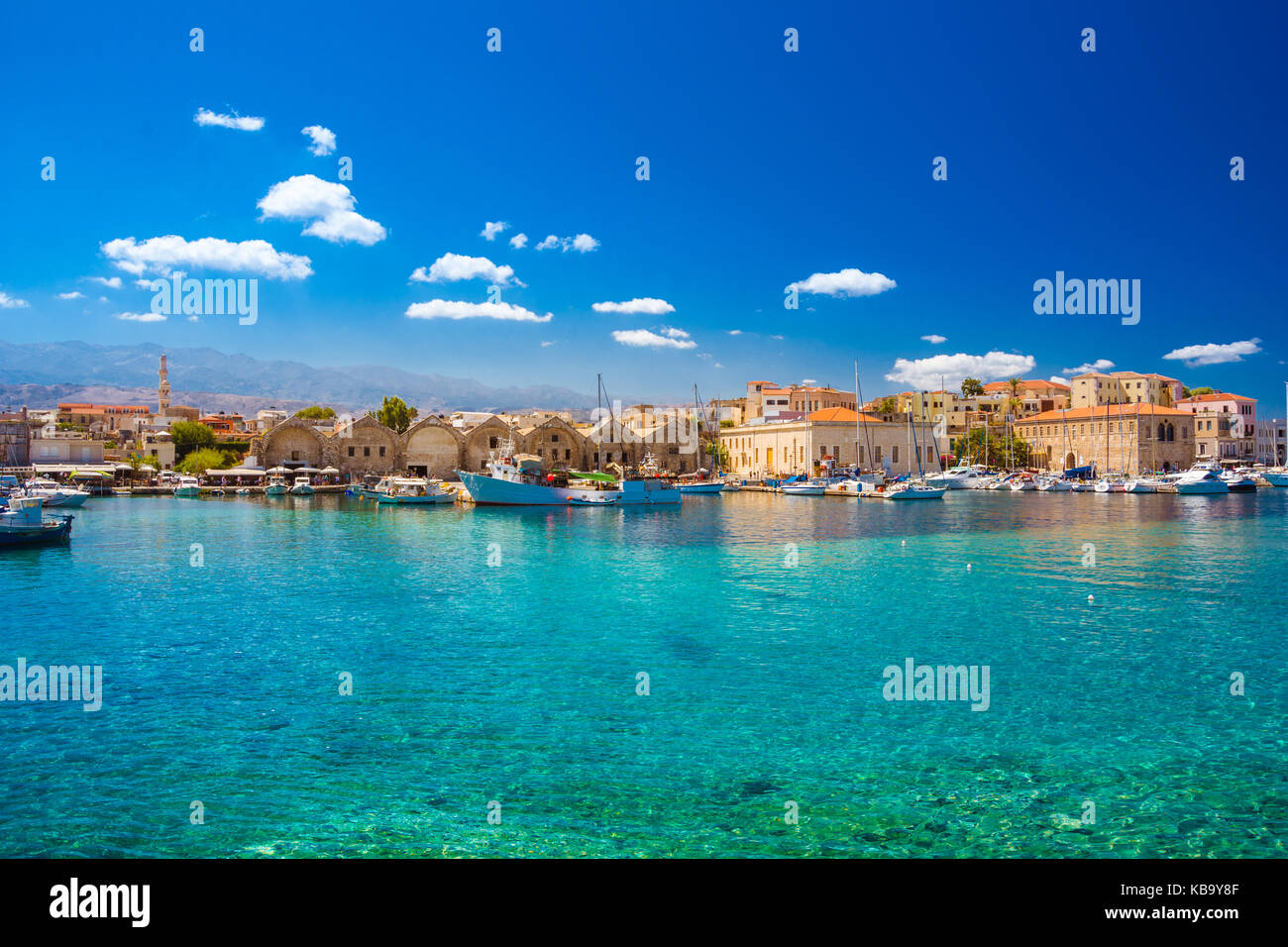 View of the old harbor of Chania with lighthouse and mosque, Crete ...