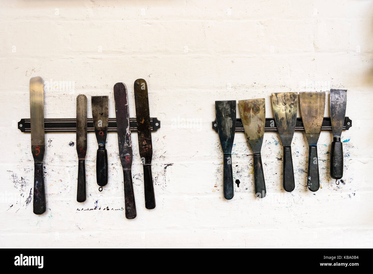 Tools for spreading ink on a magnetic rack in a printer's workshop ...