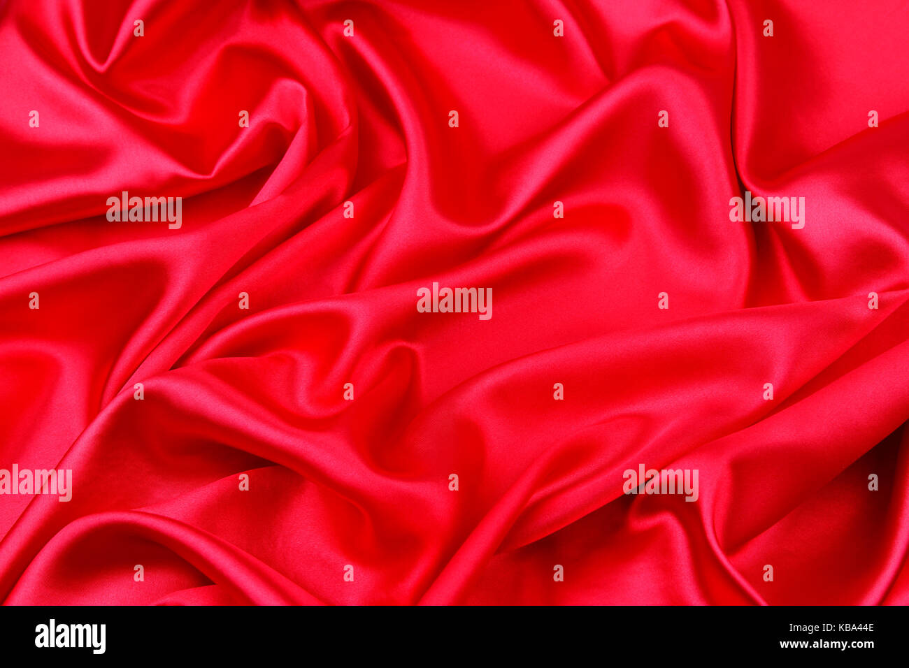 Closeup of ripples in red silk fabric Stock Photo - Alamy
