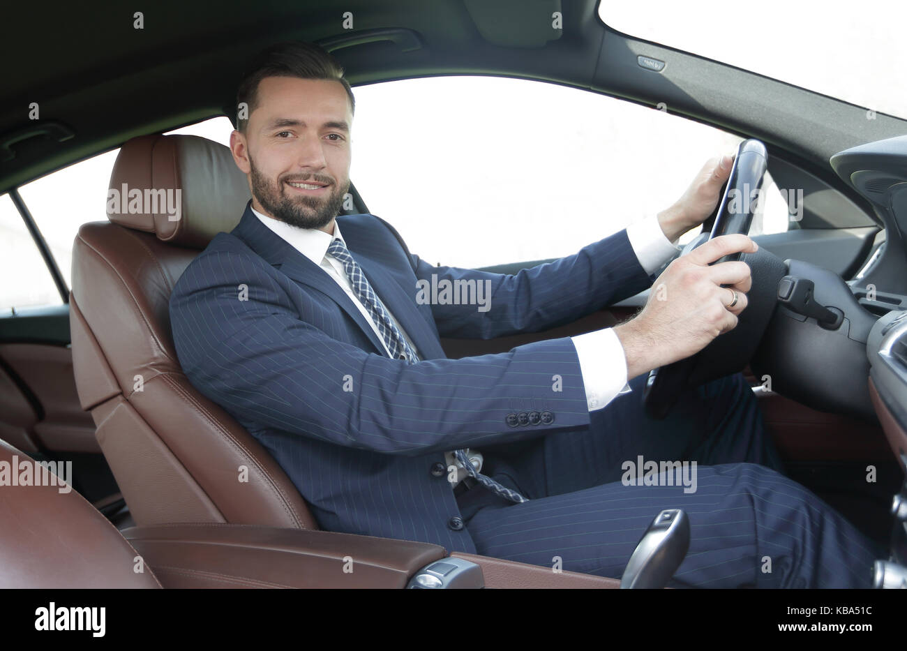 Side view portrait of confident businessman driving a car Stock Photo ...