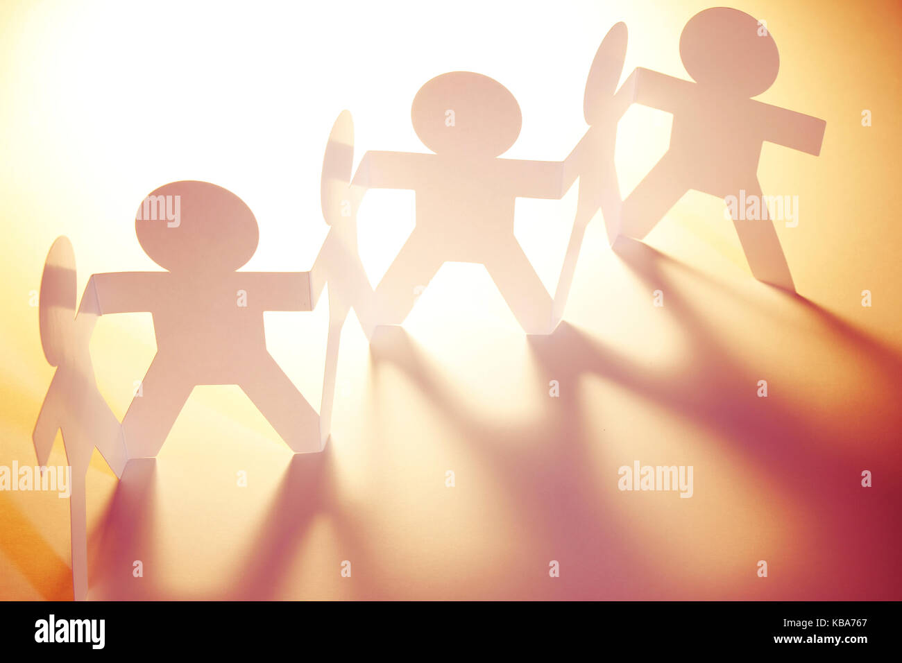 Team of paper chain people Stock Photo - Alamy