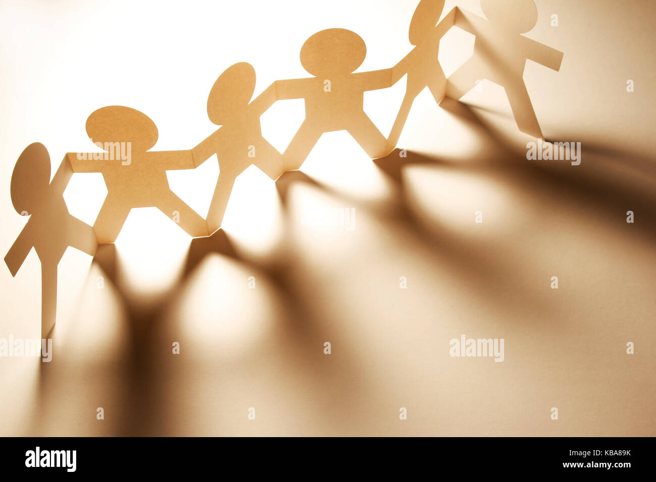 Team of paper chain people Stock Photo - Alamy