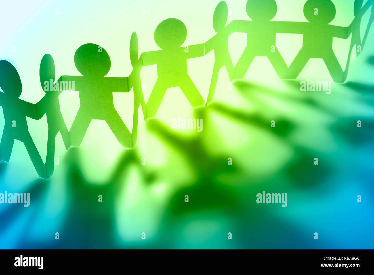 Team of paper chain people Stock Photo - Alamy