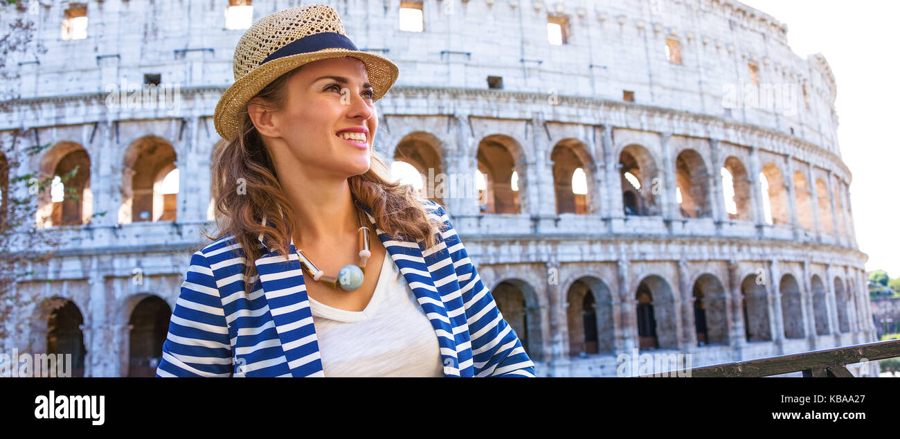 Roman Holiday. happy modern woman in the front of Colosseum in Rome ...