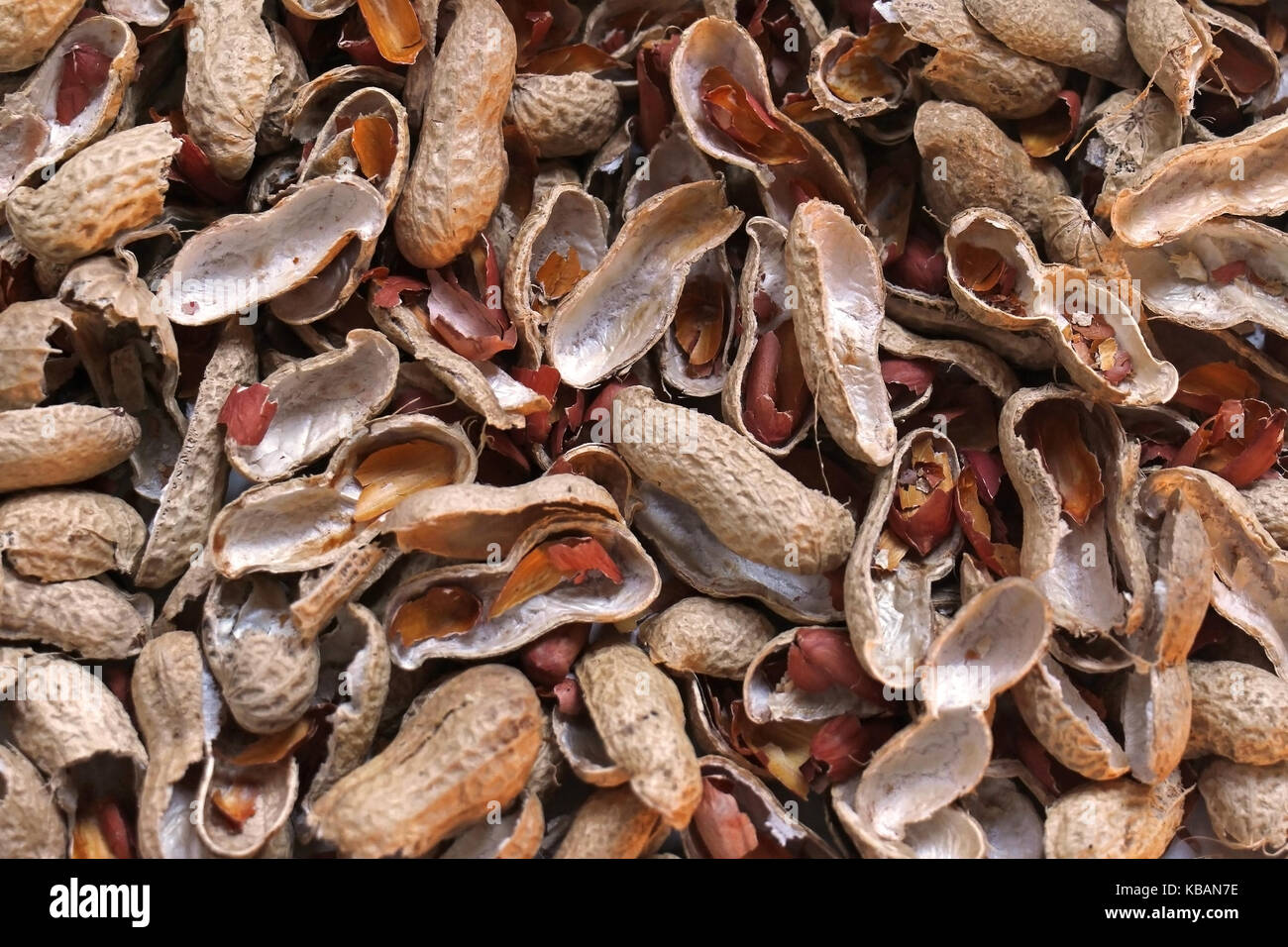 Large pile of open peanuts shells background Stock Photo - Alamy