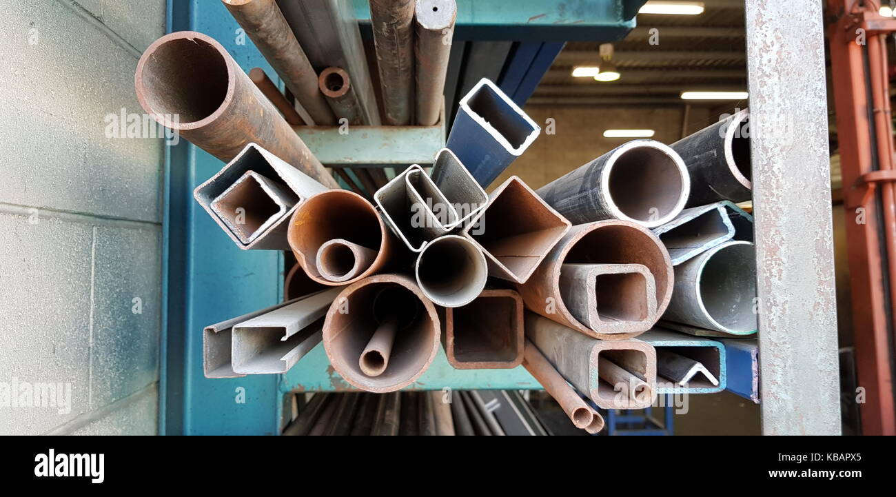 Various lengths and offcuts of steel waiting in the steel rack for use ...