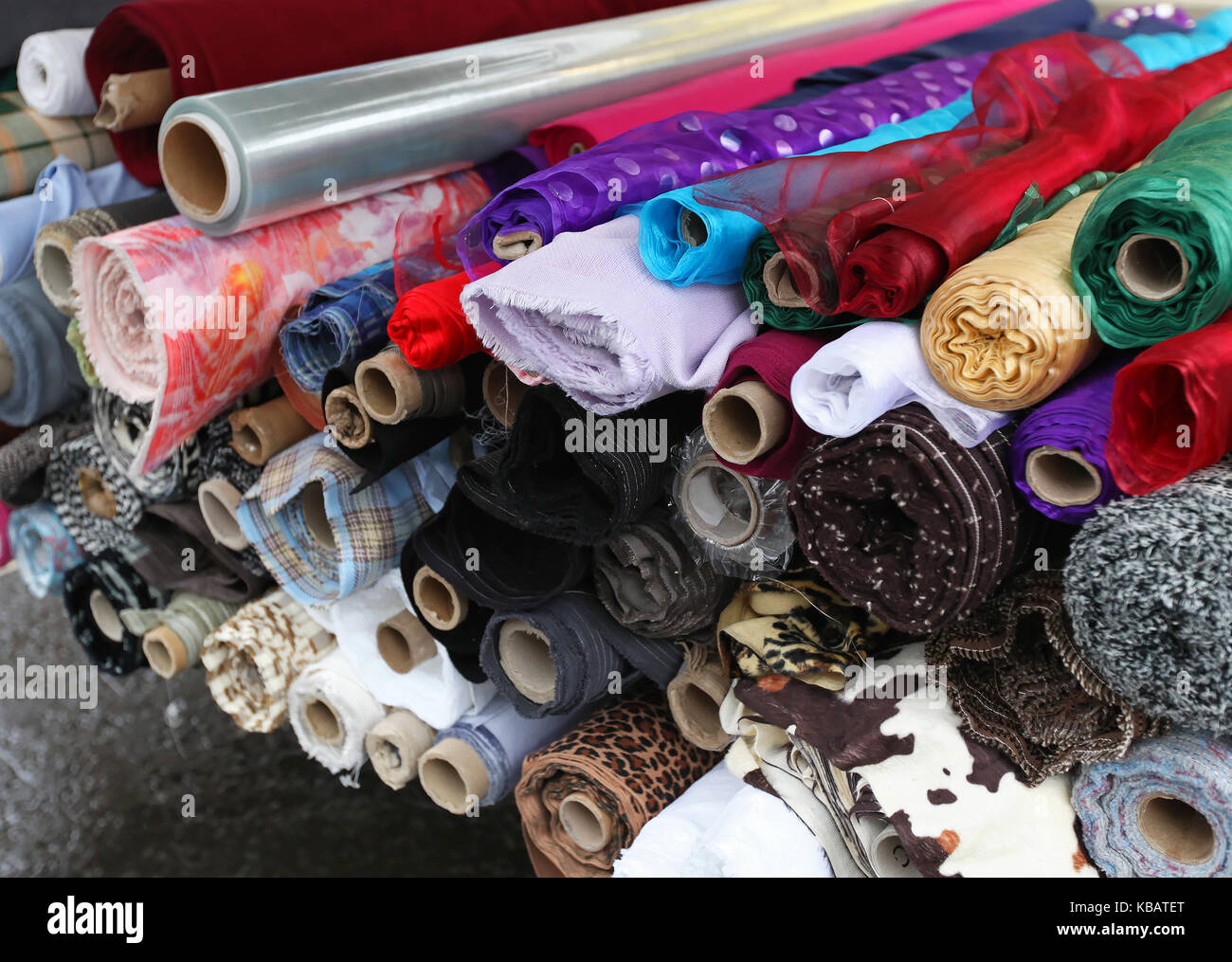 Big pile of modern pattern fashion fabrics Stock Photo - Alamy