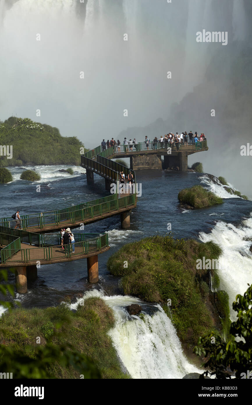 Tourists on viewing platform on Brazil side of Iguazu Falls, Brazil ...