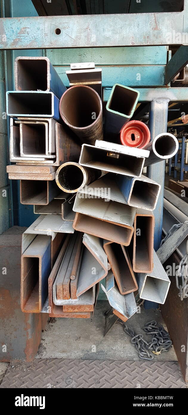 Various lengths and offcuts of steel waiting in the steel rack for use ...