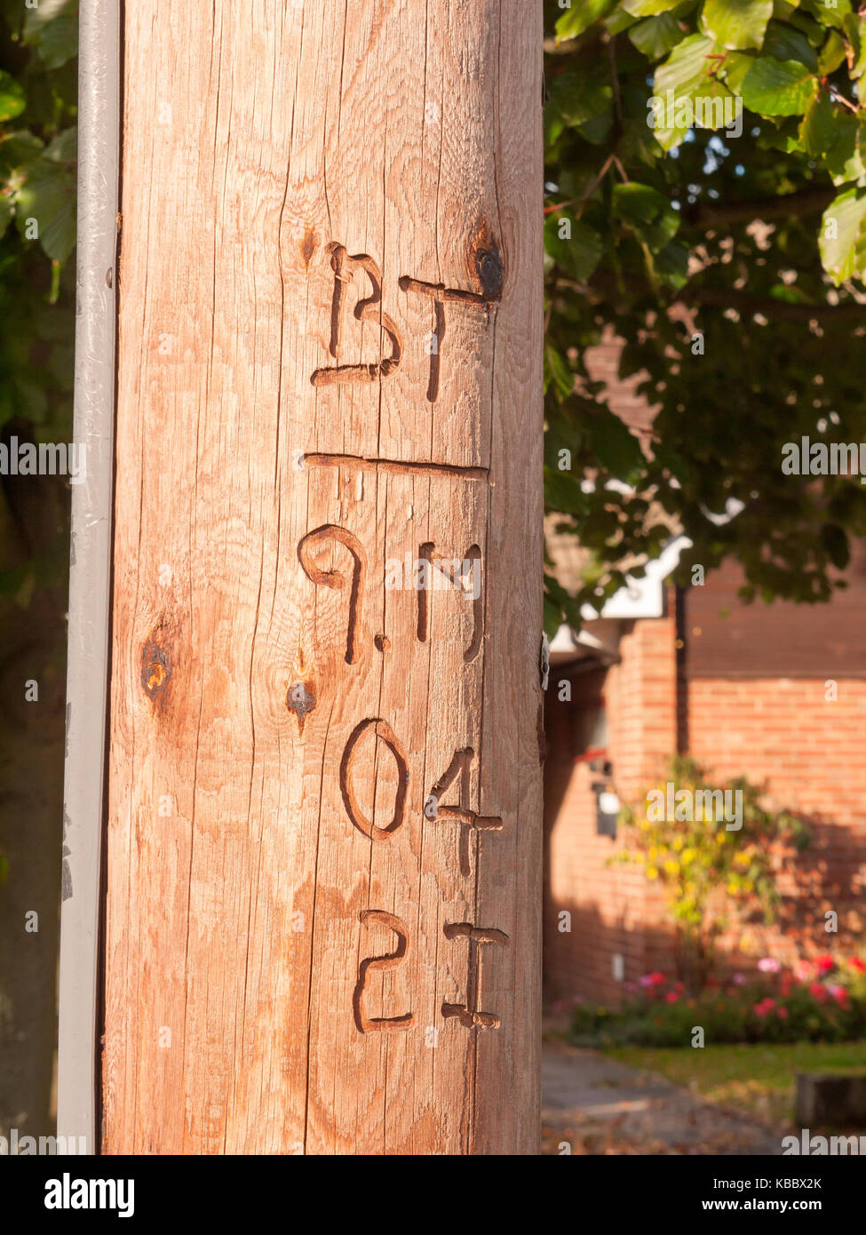 carved wooden electrical post outside lettering numbering; Essex ...
