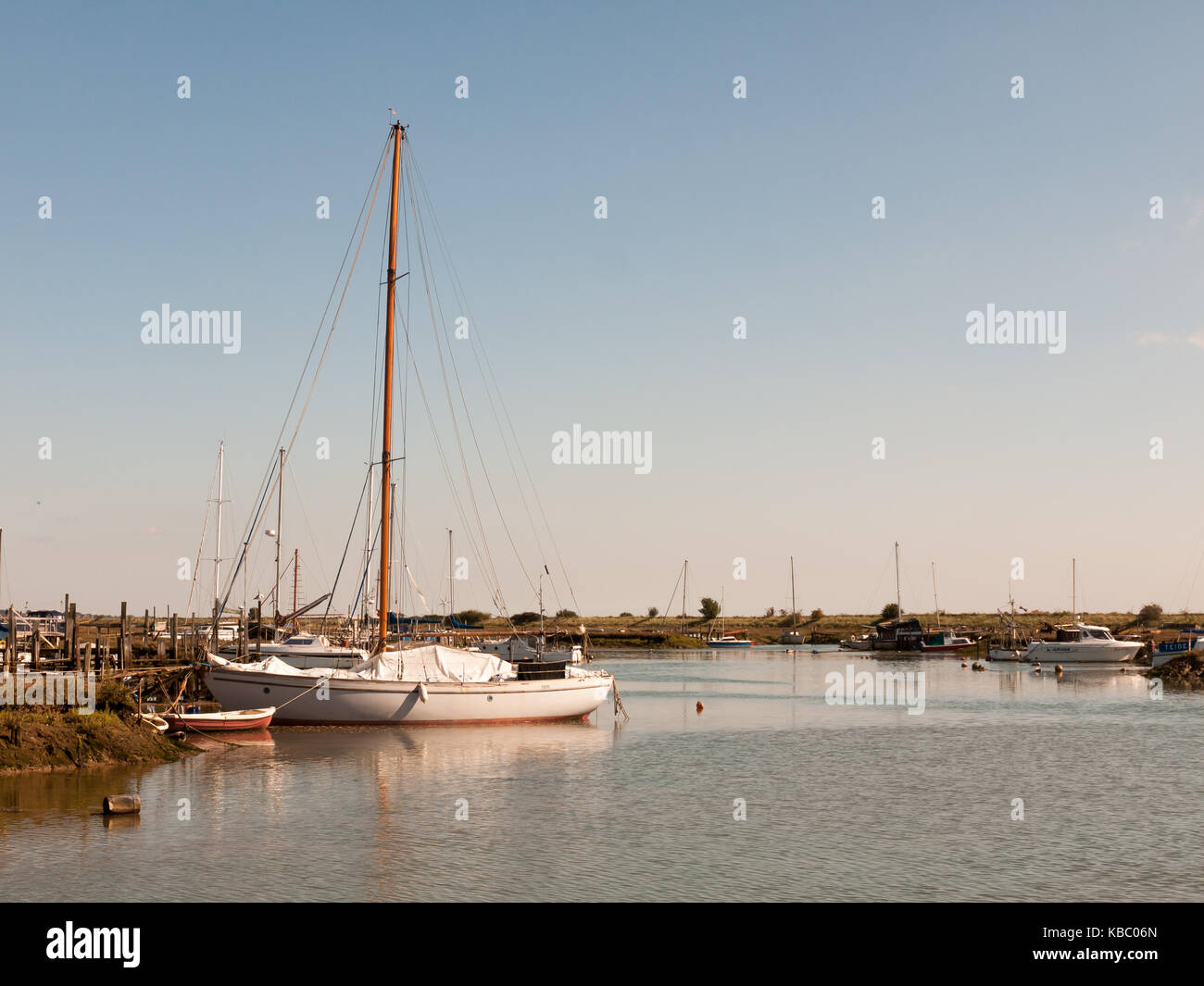 white yacht boat moored in dock of marshland tollesbury maldon; essex ...