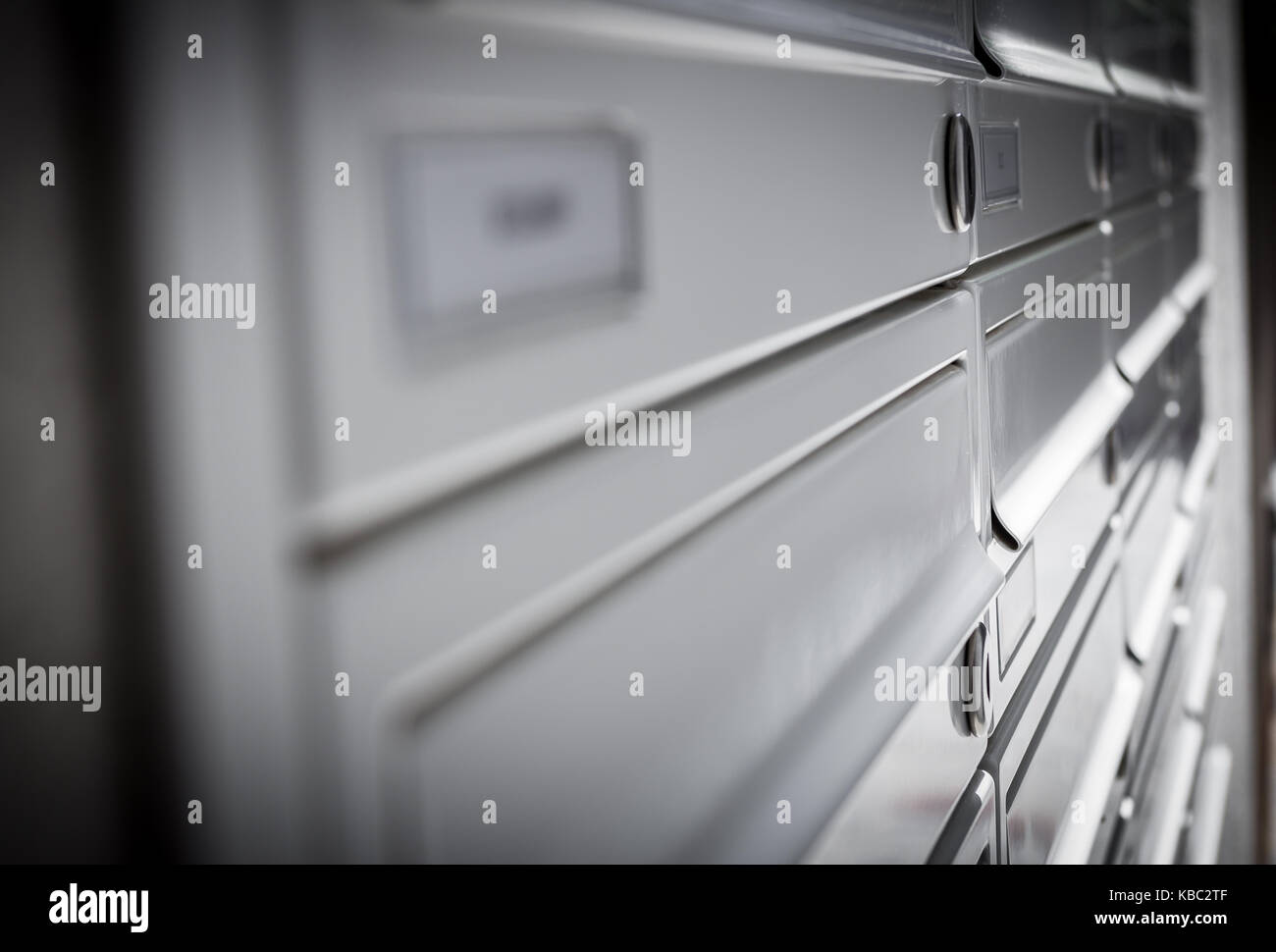 Rows of aluminum mail boxes for concepts such as safety and security ...