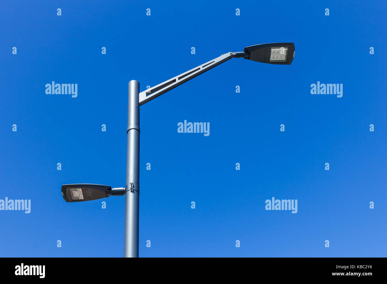 Double street light lamp post or lantern on a blue sky background Stock ...