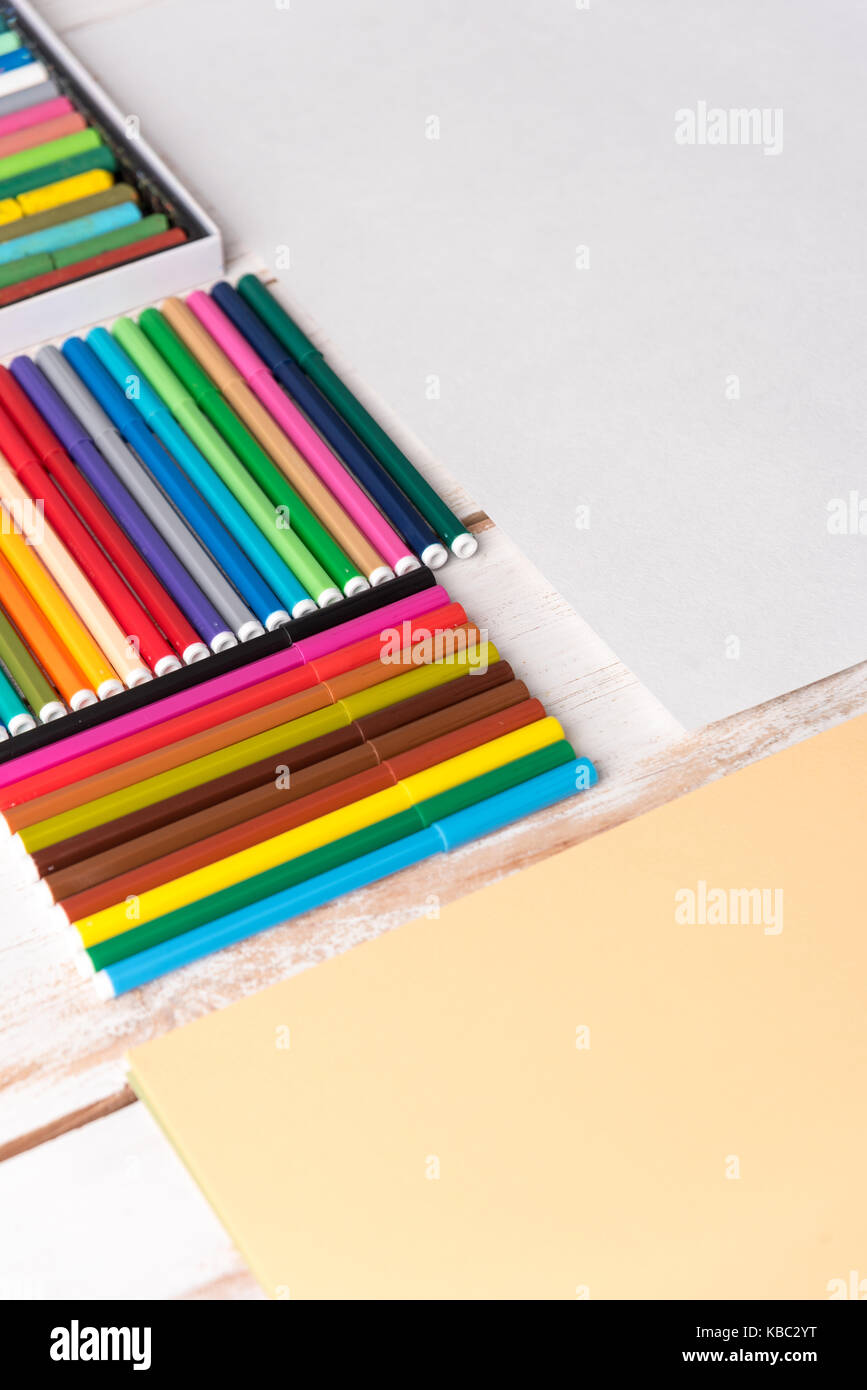 Top view of different colorful markers in boxes on white table Stock ...