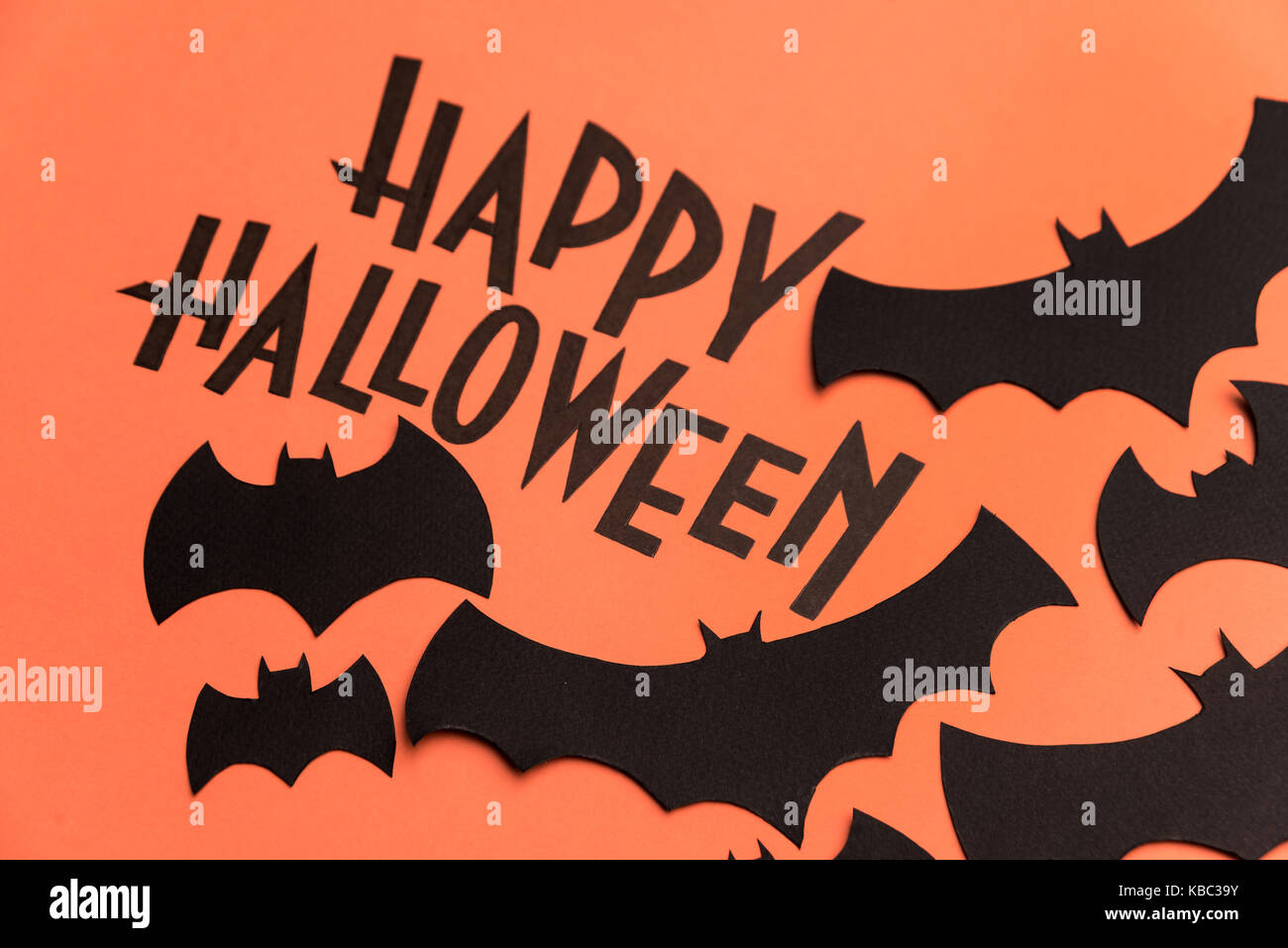 Black typeface text for halloween logo handwritten on orange background ...