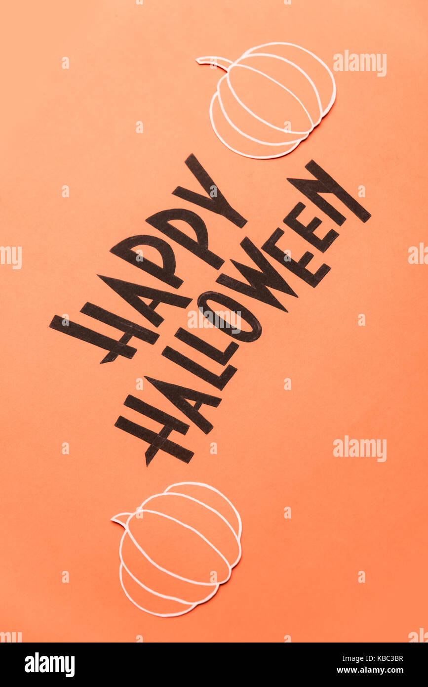Black typeface text for halloween logo handwritten on orange background ...