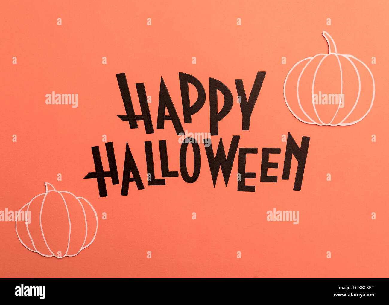 Black typeface text for halloween logo handwritten on orange background ...