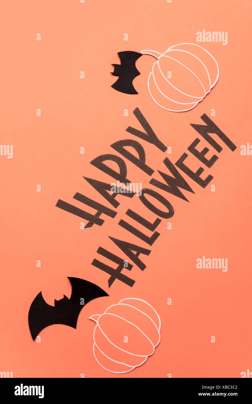 Black typeface text for halloween logo handwritten on orange background ...