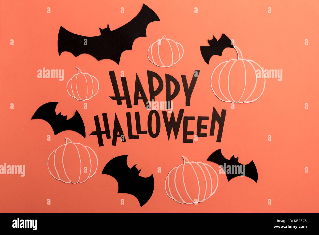 Black typeface text for halloween logo handwritten on orange background ...