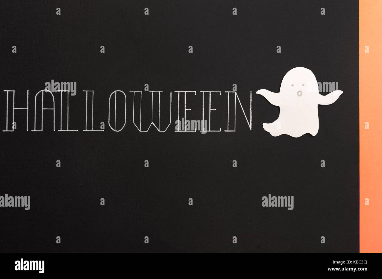White typeface text for halloween logo handwritten on black background ...