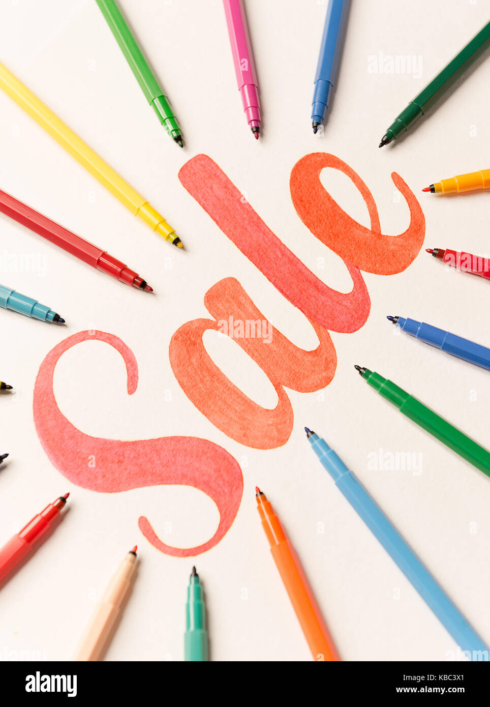 Top view of hand written calligraphy lettering 'Sale' in bunch of ...