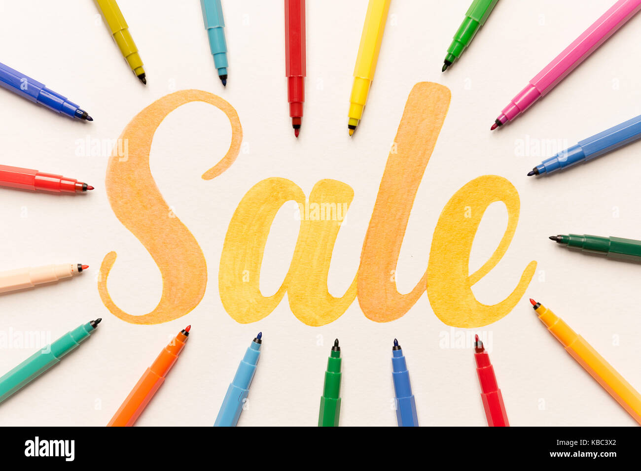 Top view of hand written calligraphy lettering 'Sale' in bunch of ...