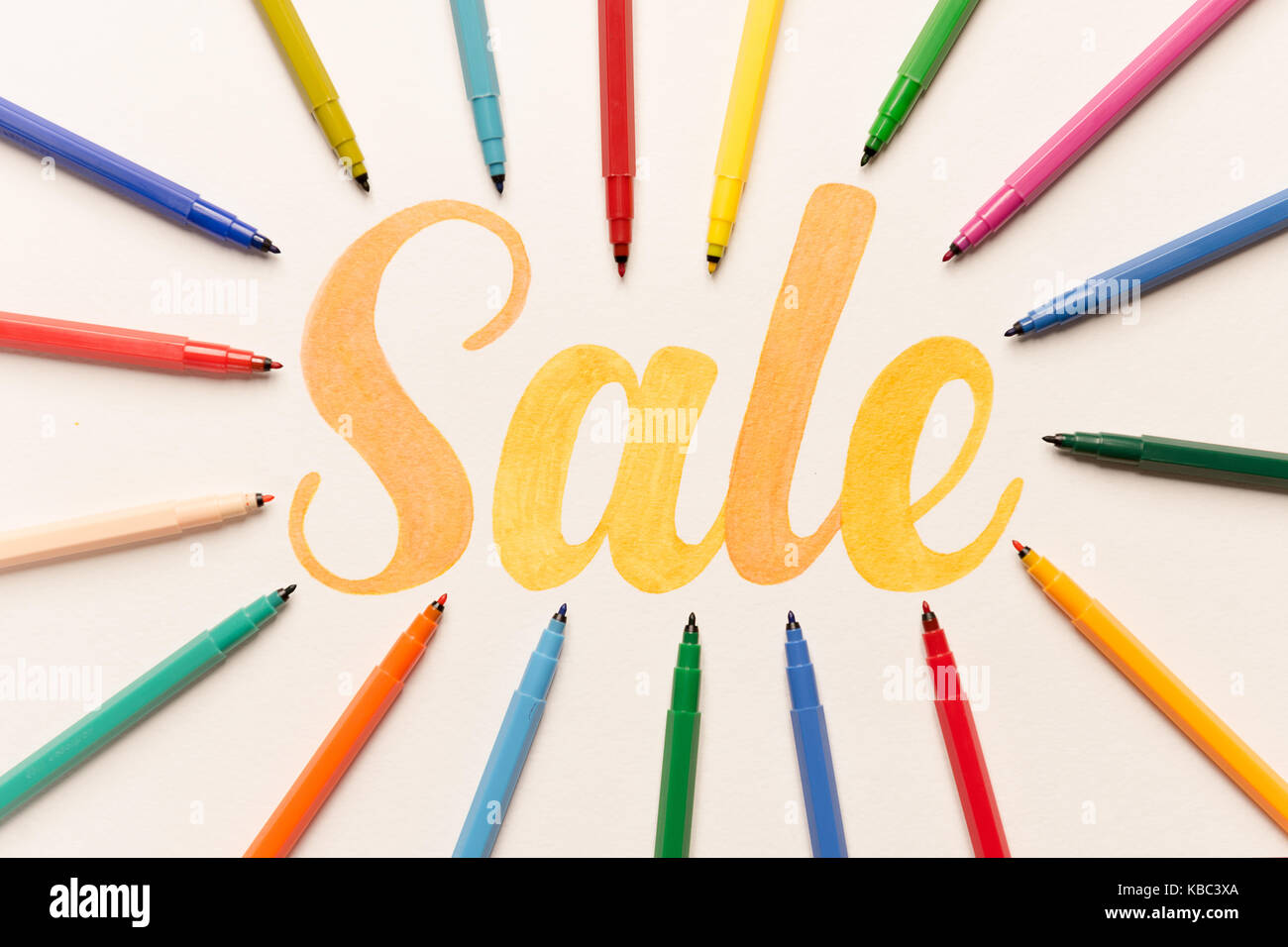 Top view of hand written calligraphy lettering 'Sale' in bunch of ...