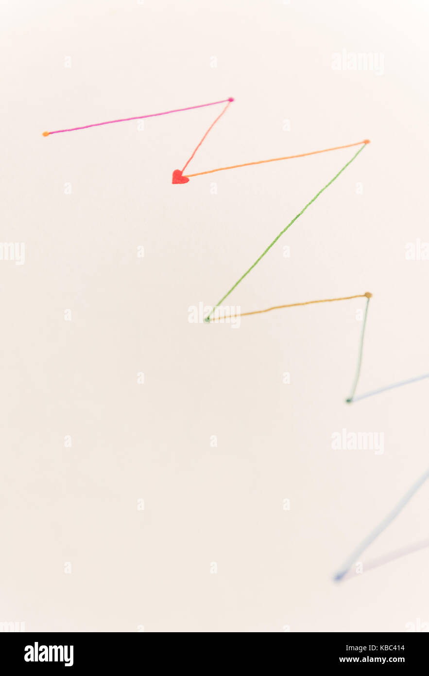 Close up of connected lines painted with colorful markers on white ...