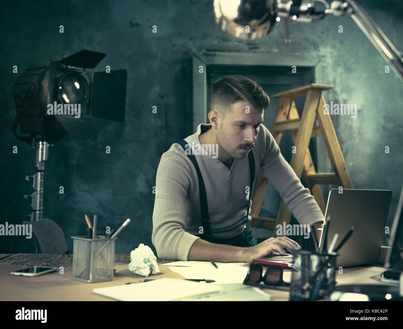 Architect working on drawing table in office Stock Photo - Alamy