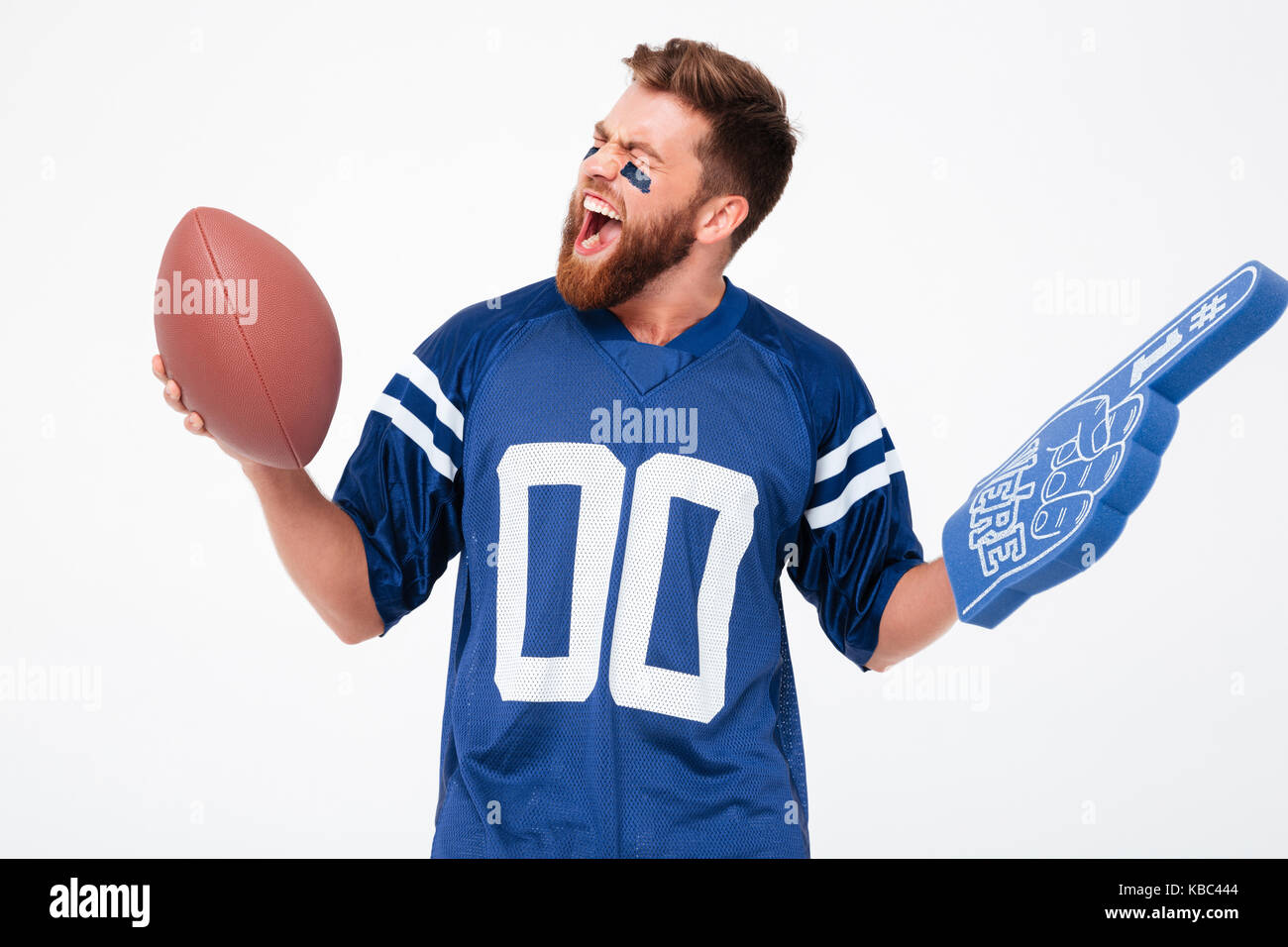 Funny agitated male fan with toys while posing isolated Stock Photo - Alamy