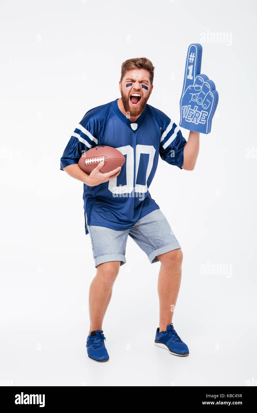 Image of screaming man fan in blue t-shirt standing isolated over white ...
