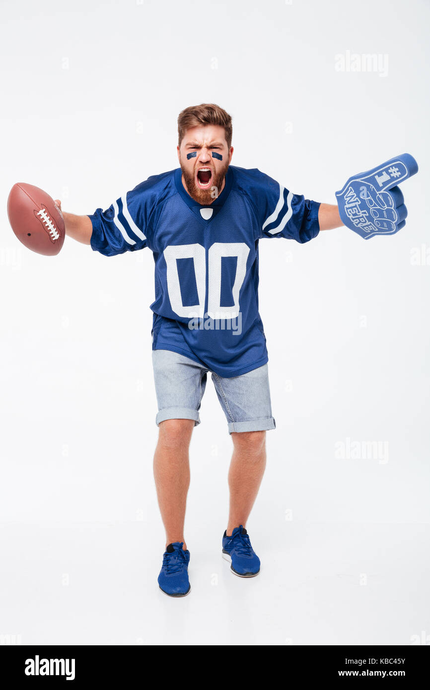 Image of screaming man fan in blue t-shirt standing isolated over white ...
