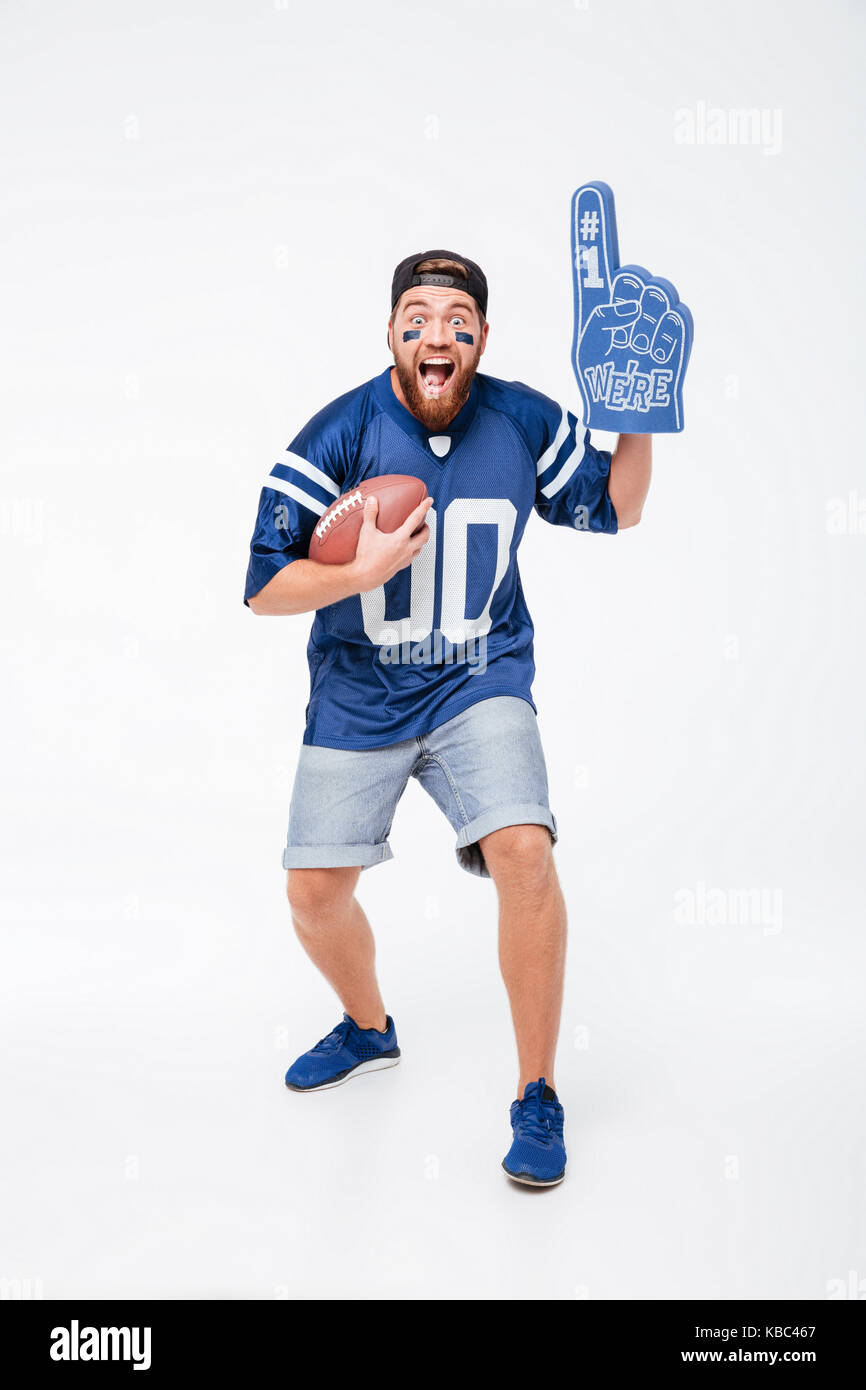 Image of screaming man fan in blue t-shirt standing isolated over white ...