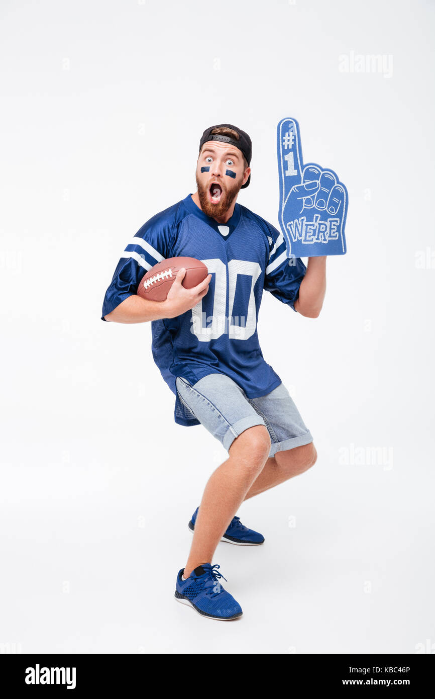 Image of screaming man fan in blue t-shirt standing isolated over white ...