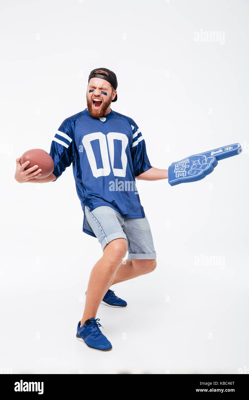 Photo of screaming man fan in blue t-shirt standing isolated over white ...