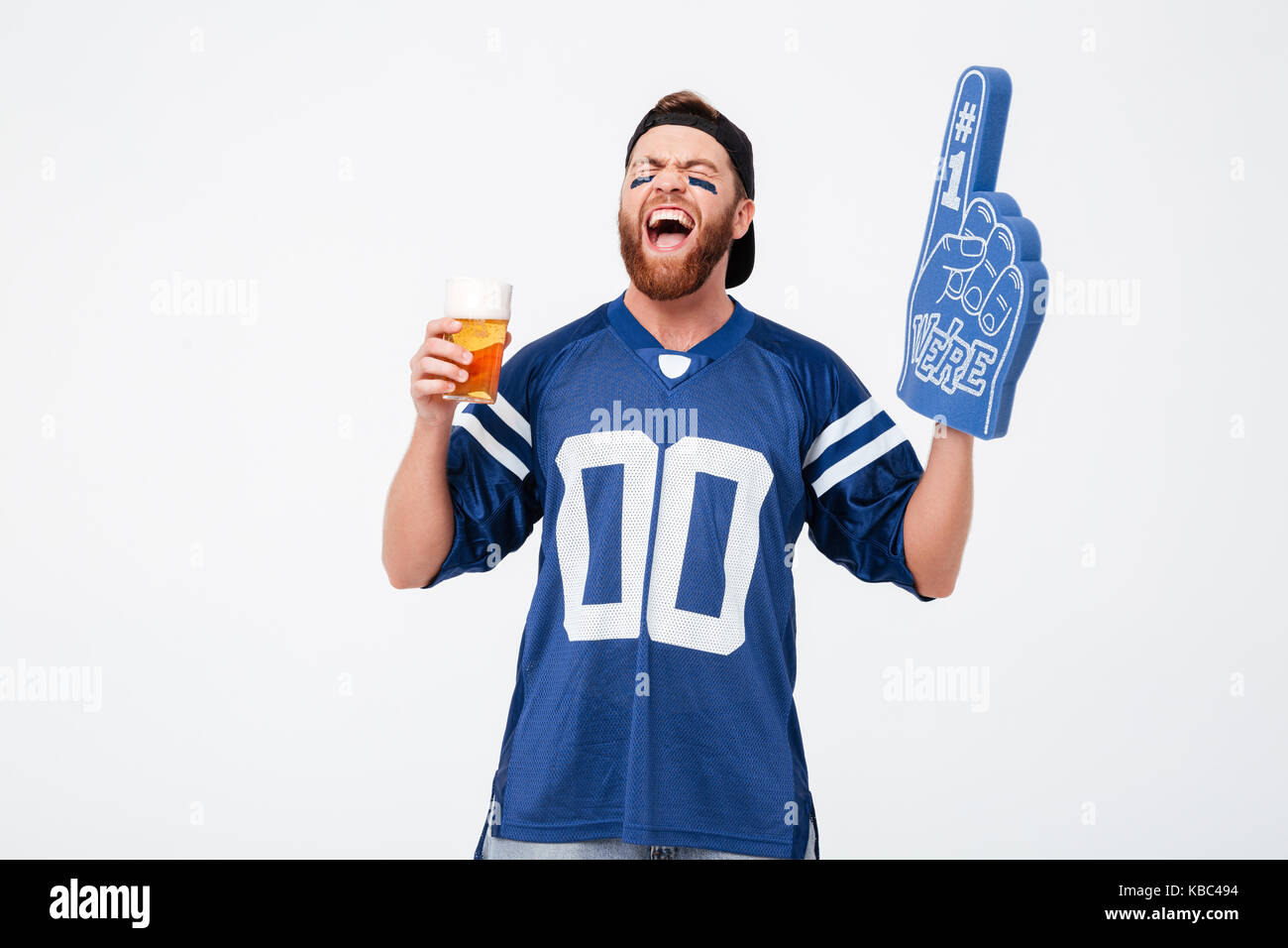 Picture of emotional man fan in blue t-shirt wearing fan finger number ...