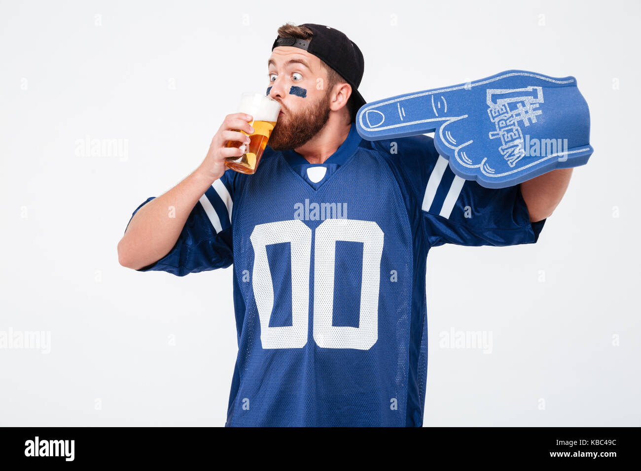 Picture of emotional man fan in blue t-shirt wearing fan finger number ...