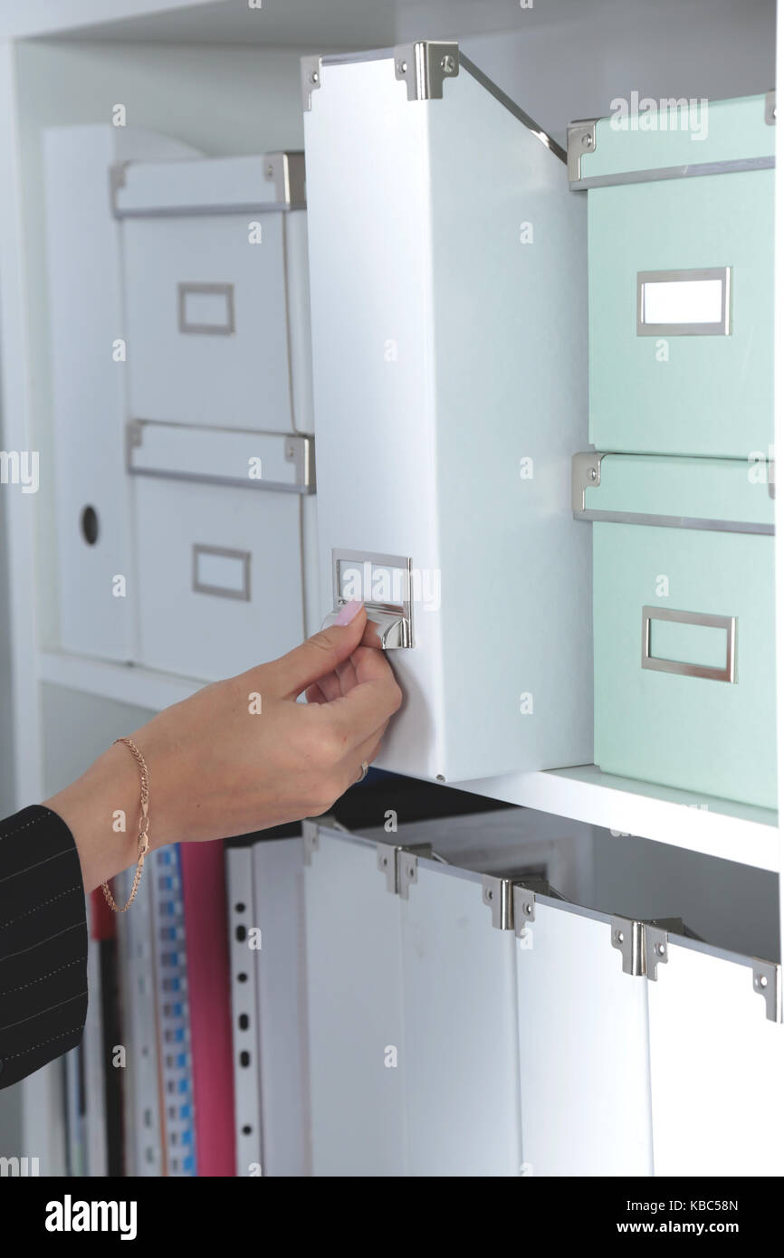 File folders, standing on shelves in the background Stock Photo - Alamy