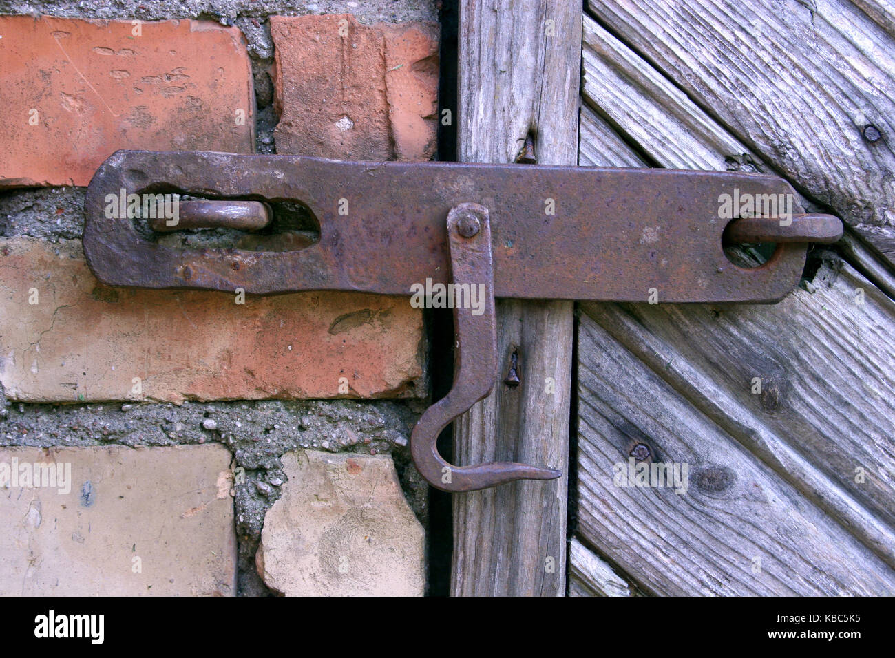 Old lock on the door. true village style Stock Photo - Alamy