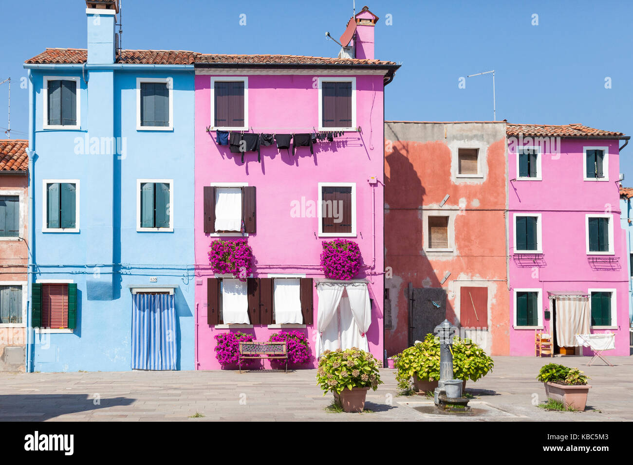 Burano, Venice, Veneto, Italy quaint village square with colorful ...